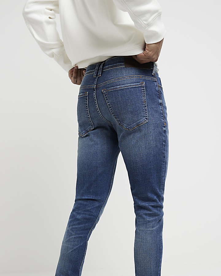 Blue super skinny spray on jeans | River Island