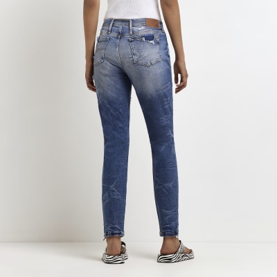 Blue ripped low rise skinny jeans | River Island
