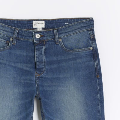 Dark blue slim fit faded jeans | River Island