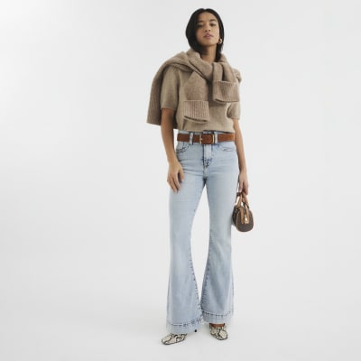 Petite blue high waisted flared jeans | River Island